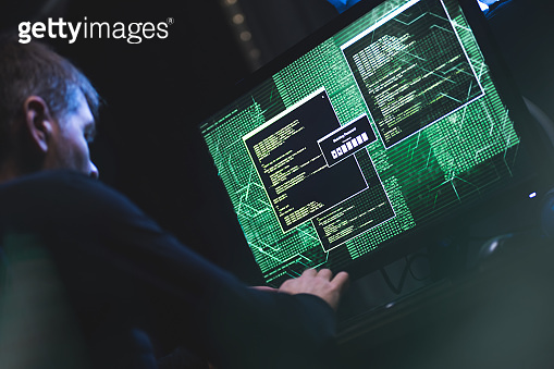 Typing password on a keyboard with data on a monitor (1212752223) - 게티이미지뱅크