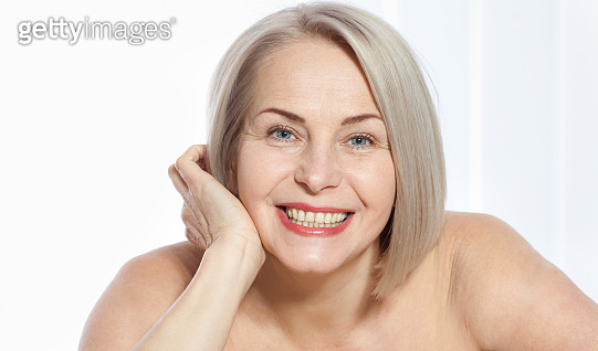 Fifty Year Old Woman Is Very Pleased With Her Well Groomed Face