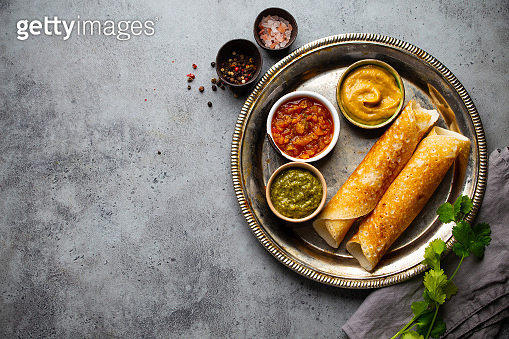 Traditional Indian rice pancakes Dosa with different dips chutney ...