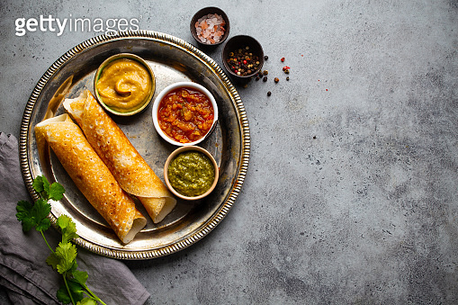 Traditional Indian rice pancakes Dosa with different dips chutney ...