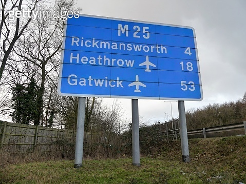 M25 motorway sign at Micklefield Green, Hertfordshire showing distances ...