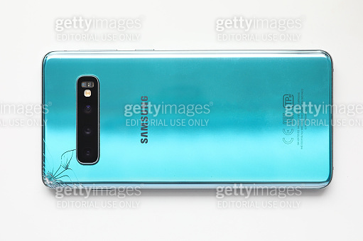 Samsung galaxy s10 smartphone with cracked back lid close-up ...