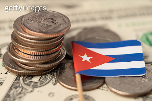 Stack of coins with Cuba flag on USA dollar banknotes background. 이미지 ...