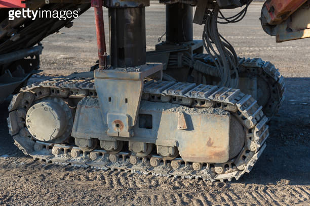 Excavator tracks. Old iron caterpillars of the bulldozer of the tractor ...