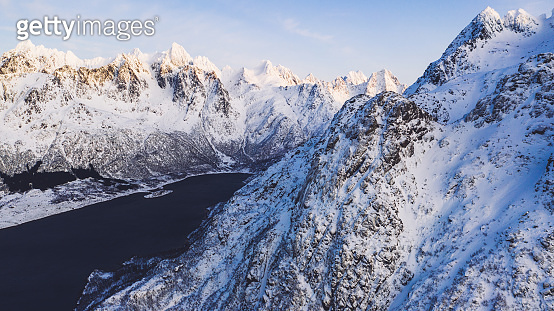 Breathtaking bird's eye view of majestic fjord mountains covered with ...