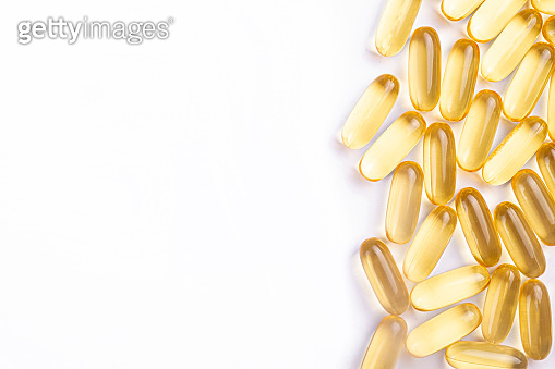 Bunch of healthy nutritious food supplements in a form of gel pills ...