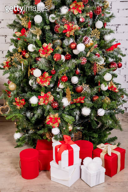 Different Christmas presents with handmade decoration.Wrapped in red ...