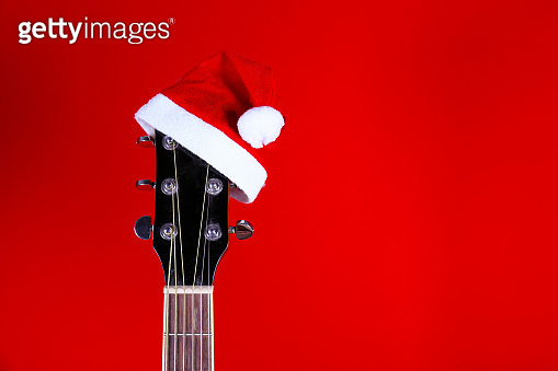Christmas music concept. Acoustic guitar with steel strings and santa ...