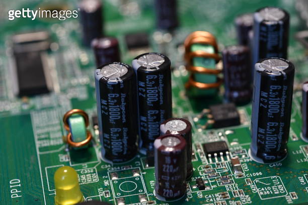 Extreme detail on the electronic components of a modern pc motherboard ...