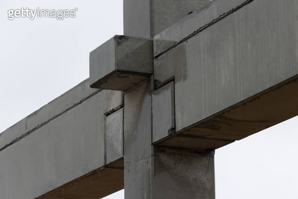 concrete cross beams are connected to concrete columns for a factory ...