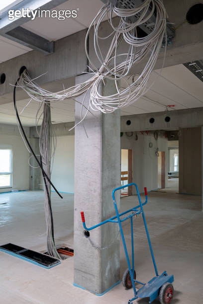 on construction site of a factory building the thick cable harnesses ...