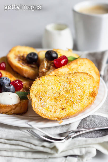 Traditional sweet French toasts with blueberry, dried cherry, mint and ...