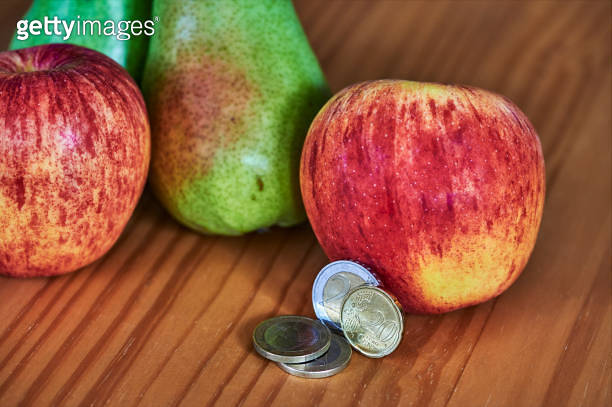 Fruit lying together with money. 이미지 (1227608689) - 게티이미지뱅크