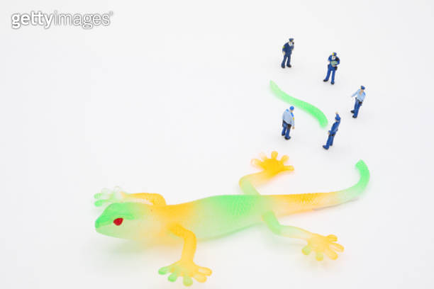 A miniature police officer surrounding a lizard's tail cut (1291633786 ...
