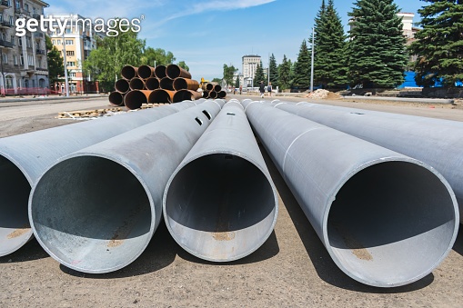 Installing new sewer pipes in place of old ones during road works ...