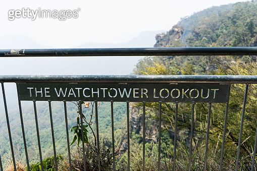 Watchtower lookout sign and metal railing overlooking the Blue ...