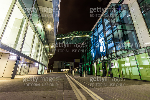 Exterior of new Tottenham Hotspur stadium illuminated at night in ...
