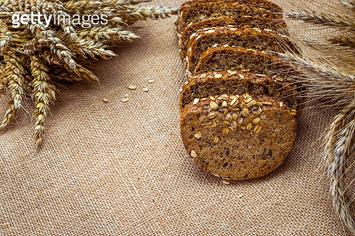 Sliced Multigrain. Rye bakery with crusty loaves and crumbs. Fresh loaf ...