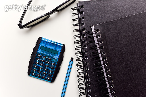 Calculating tax return numbers and figures on office desk concept for ...