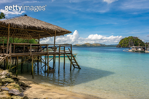 Wood terrace on sandy beach. Tropical beach in El Nido Palawan ...