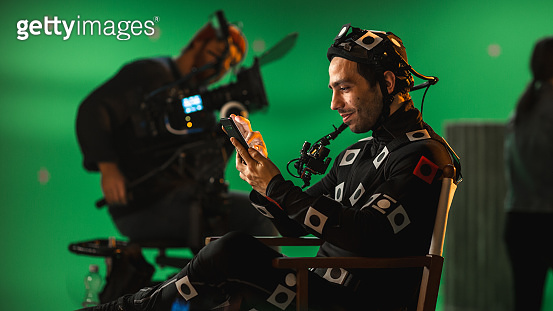 Handsome Smiling Actor Wearing Motion Capture Suit and Head Rig having ...