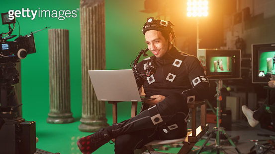 Handsome Smiling Actor Wearing Motion Capture Suit and Head Rig having ...