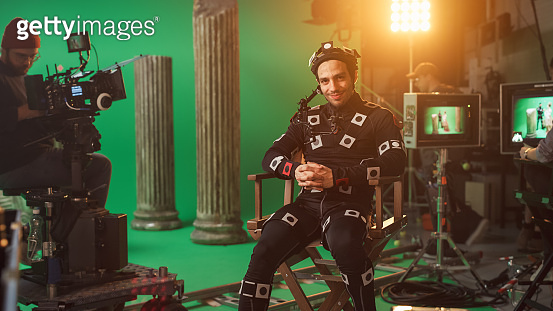 Handsome Smiling Actor Wearing Motion Capture Suit and Head Rig having ...