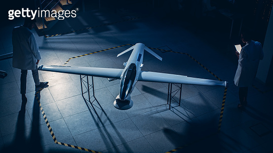 Two Aerospace Engineers Work On Unmanned Aerial Vehicle / Drone ...