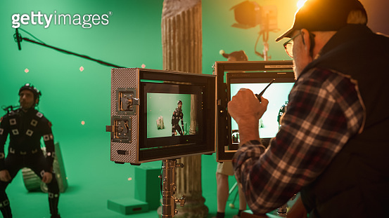 Director Looks at Displays Directs Green Screen CGI Scene with Actor ...