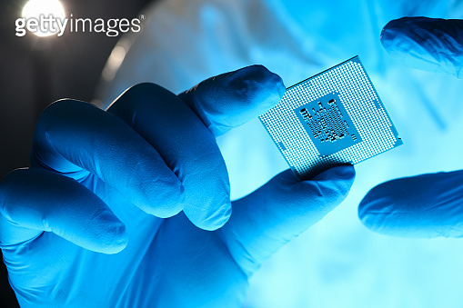 Close-up gloved hands holding detail microchip 이미지 (1220136527) - 게티이미지뱅크