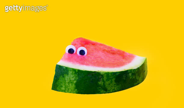 Anthropomorphic Face with Googly Eyes on a Watermelon with Colored ...