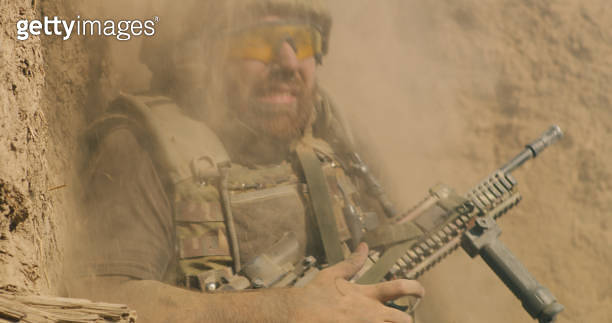 Scared fighter hiding in trench during war 이미지 (1279117868) - 게티이미지뱅크