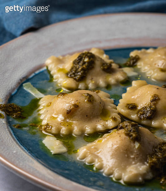 Ravioli stuffed with Acorn squash and topped with basil pesto. 이미지 ...