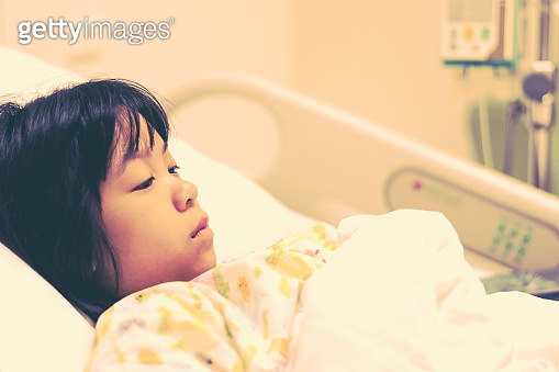 Child patient with IV line in hand sleep on hospital bed. Medical ...