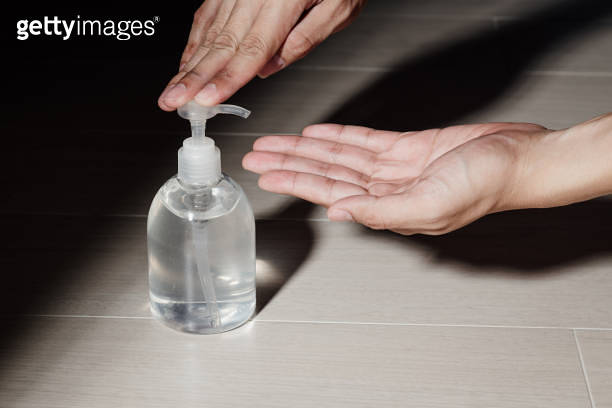 Hands using alcohol sanitizer gel pump for prevent infection, Covid-19 ...