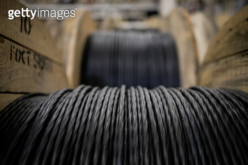 Vertical coils industrial wires. Many turns of main electrical cable is ...