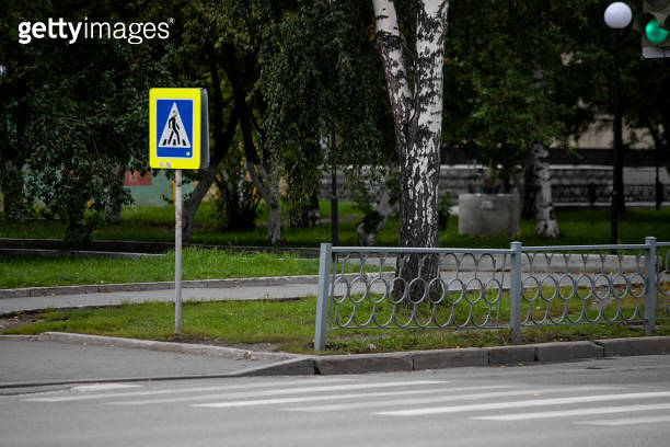 Pedestrian crossing sign board. Crosswalk pictogram sign on the traffic ...