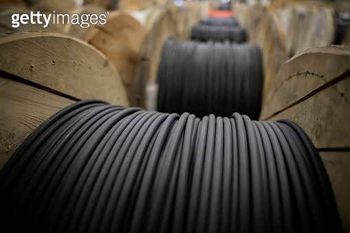 Vertical coils industrial wires. Many turns of main electrical cable is ...
