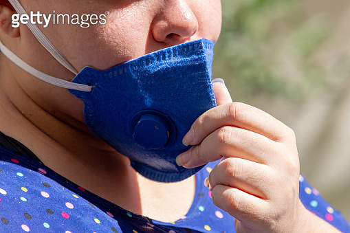 Woman with marks on her face and mask pff2 n95, protection against ...