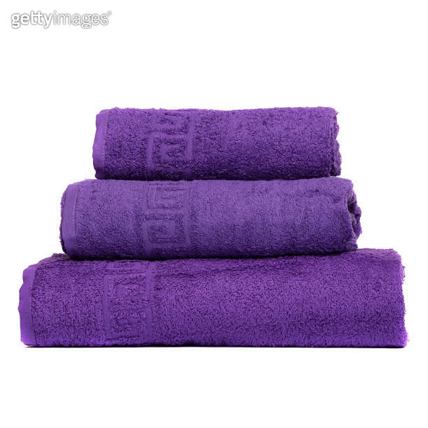 3 frotte towels purple color, bedroom towel white backgroung. Colorful ...