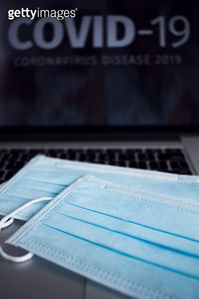 Surgical masks placed on computer 이미지 (1211800027) - 게티이미지뱅크