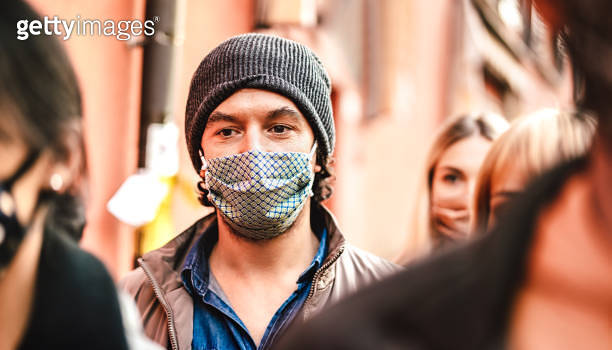 Urban crowd of citizens walking on city street wearing face mask - New ...