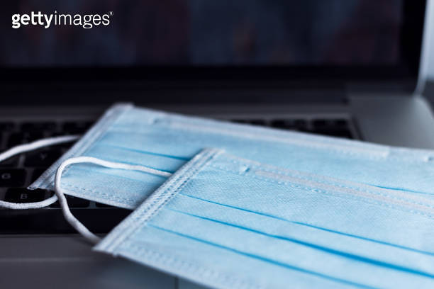 Surgical masks placed on computer 이미지 (1212081047) - 게티이미지뱅크
