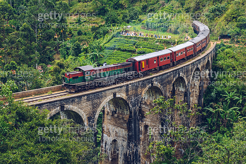 An iconic train pass through the Nine Arch Bridge a very picturesque ...
