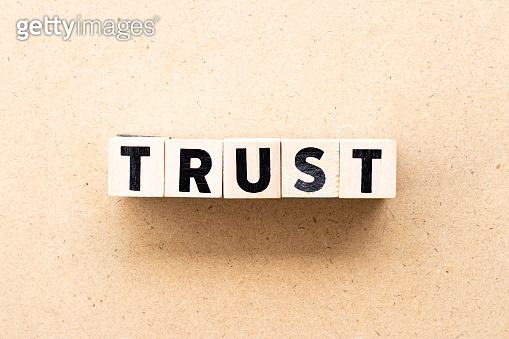 Letter block in word trust on wood background 이미지 (1286143309) - 게티이미지뱅크