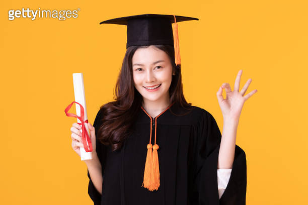 Happy Graduate asian woman in cap and gowm holding Certificated or ...