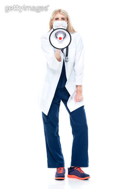 Caucasian young women doctor standing wearing lab coat and holding ...