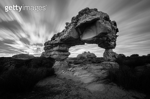 A dramatic black and white landscape photograph of an incredible rock ...