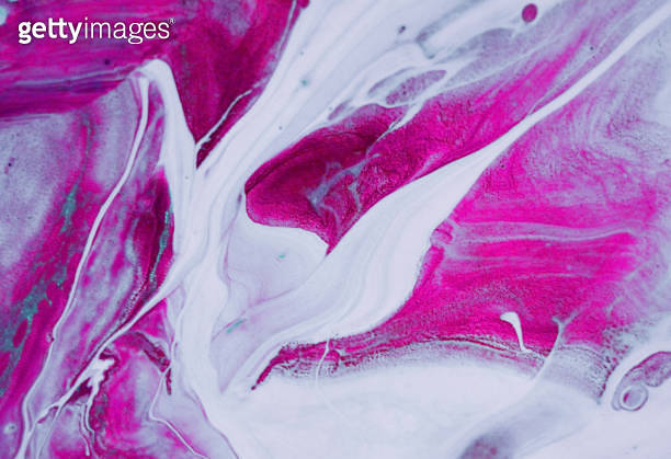 Pink pigment in water on a white background, vortexes and dispersion of ...