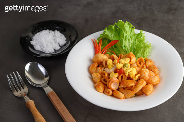 The pipe rigate italian pasta with tomato sauce and egg, chili and ...